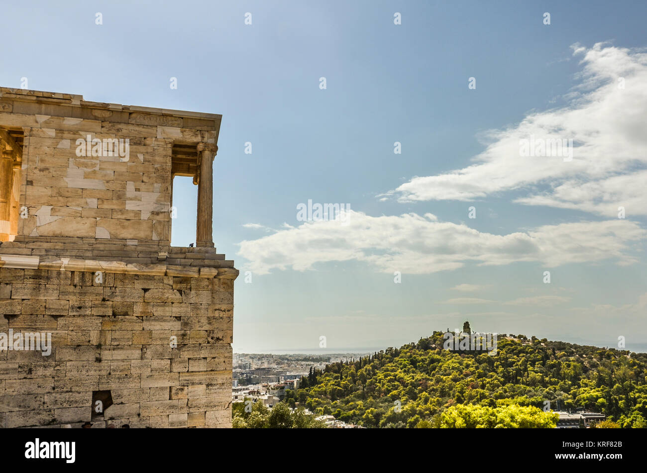 close-up view of the buildings of the Acropolis and behind the monument ...