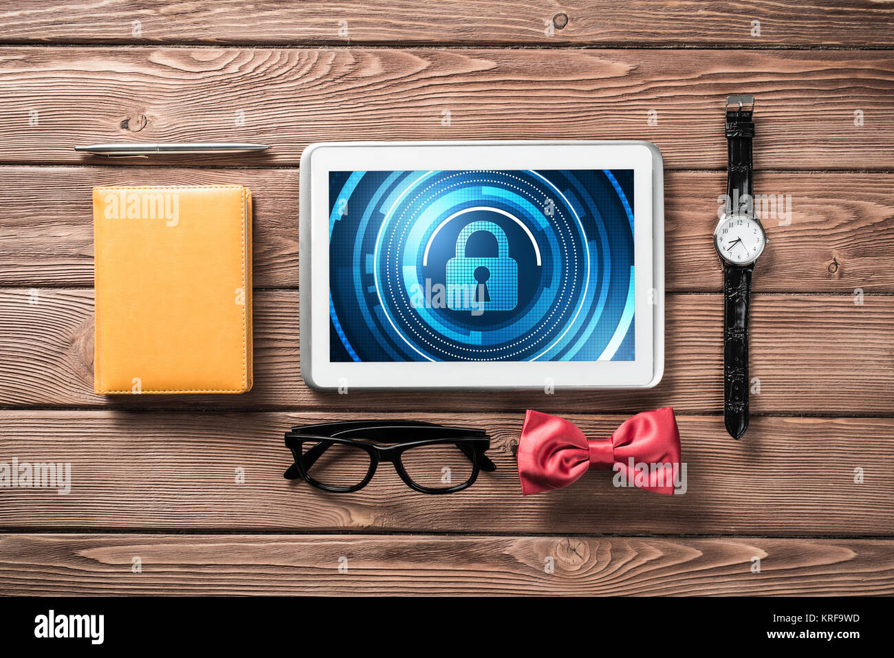 Gentleman kit of tablet watch glasses and notebook on wooden table ...