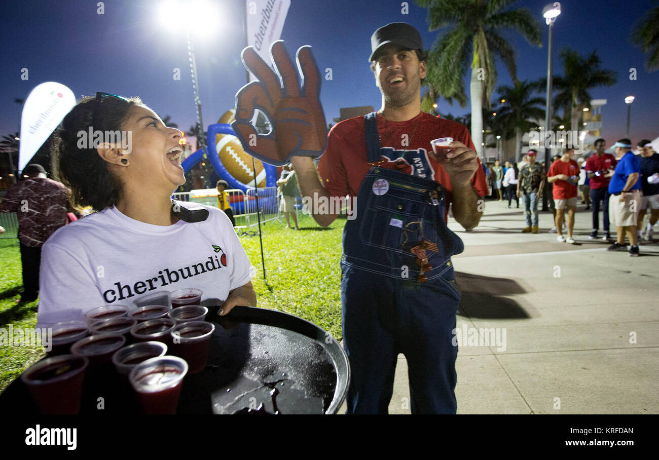 Boca Raton, Florida, USA. 19th Dec, 2017. Jessica Bilgrand hands out ...