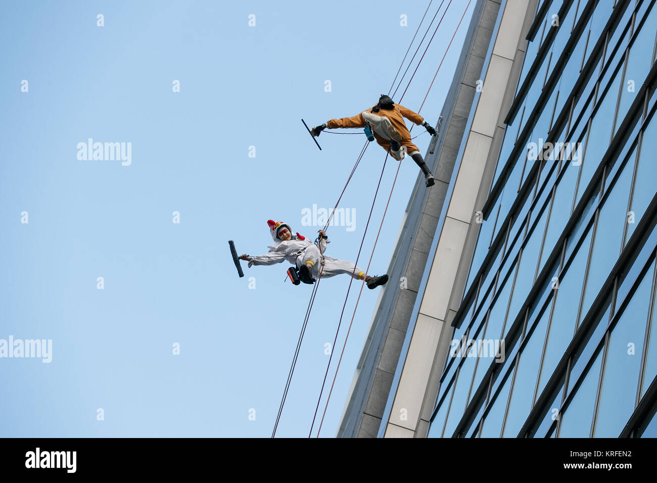 Tokyo, Japan. 20th December, 2017. Window cleaners dressed as dog and ...