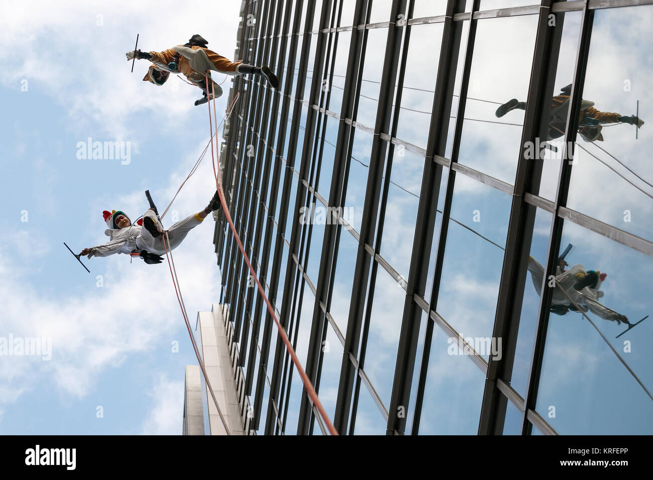 Tokyo, Japan. 20th December, 2017. Window cleaners dressed as dog and ...