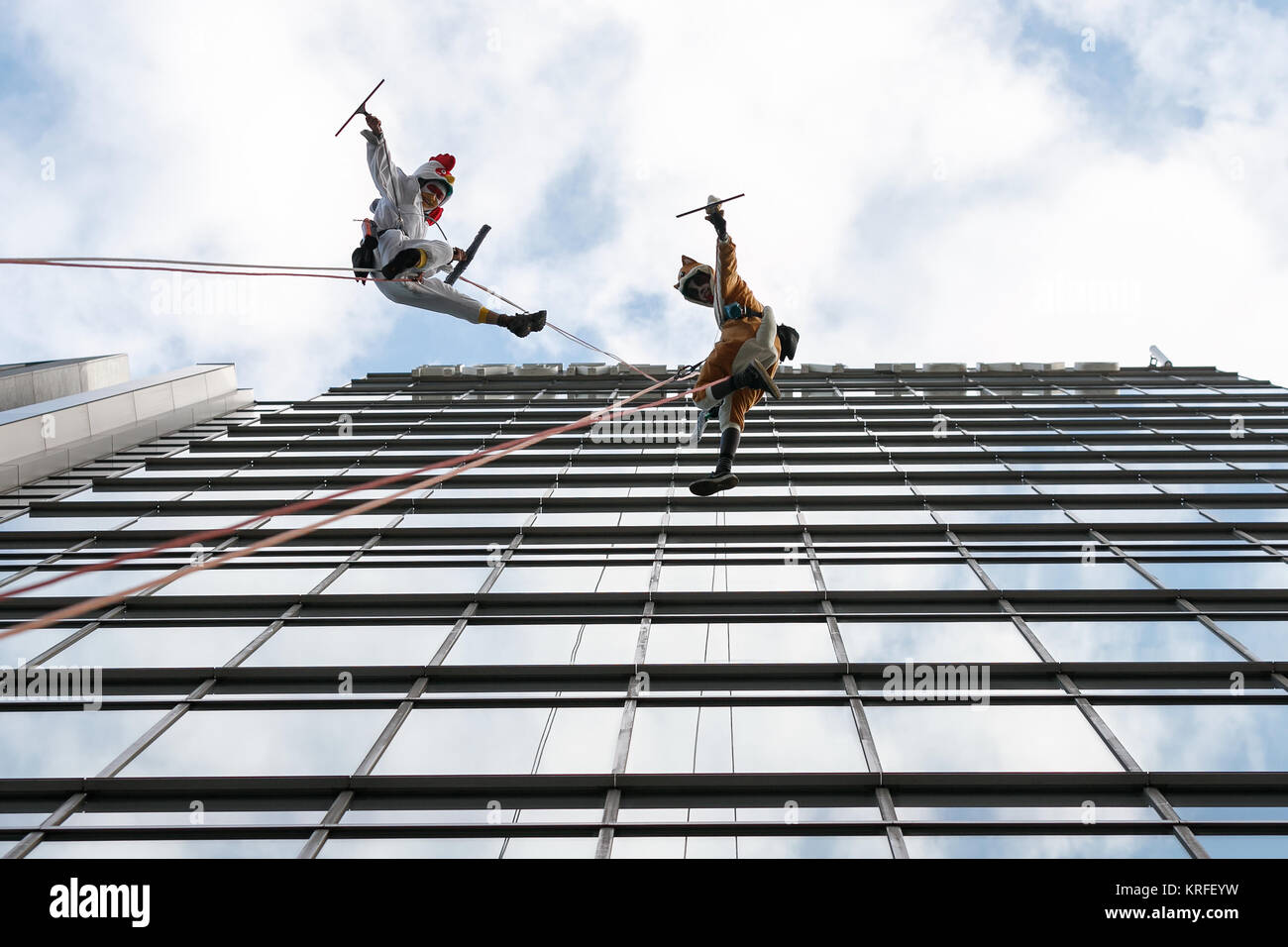 Tokyo, Japan. 20th December, 2017. Window cleaners dressed as dog and ...