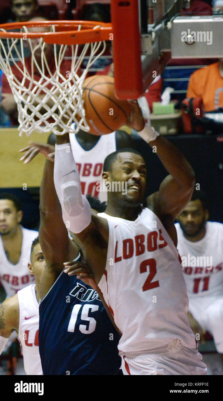 U.S. 19th Dec, 2017. SPORTS -- UNM's Sam Logwood, 2, goes up against ...