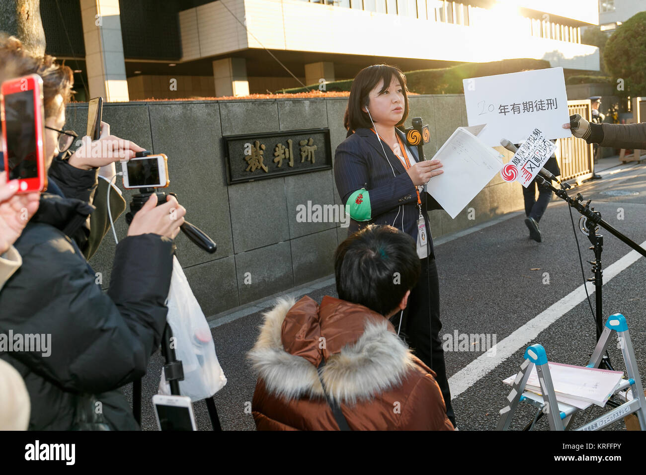 A Hong Kong Phoenix Television reporter announces the result of the ...