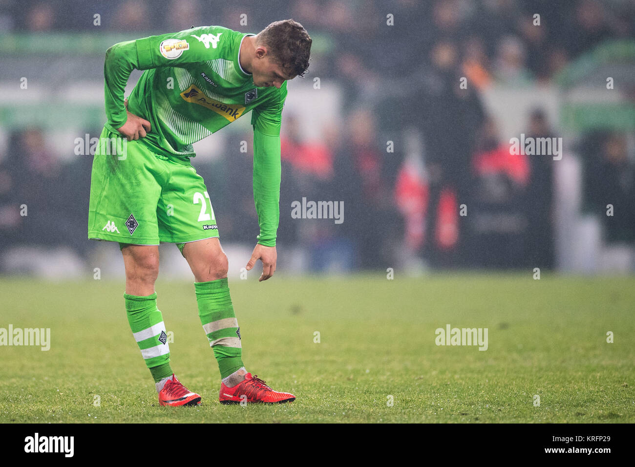 Gladbach's Mickael Cuisance looks on the ground during the German DFB ...