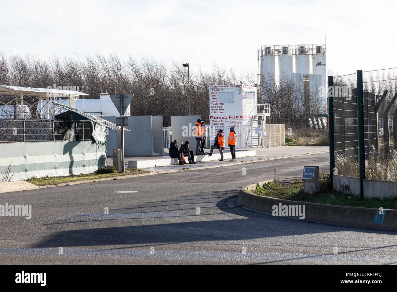 Calais, France, December 20, 2017: Two African immigrants are waiting ...