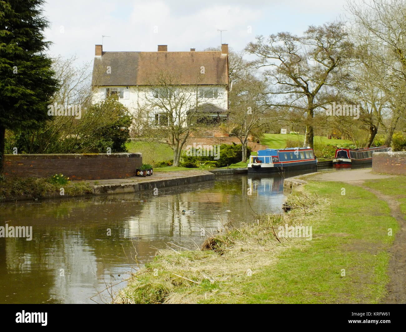 View of a house and barges on a small aqueduct just north of the M42 ...