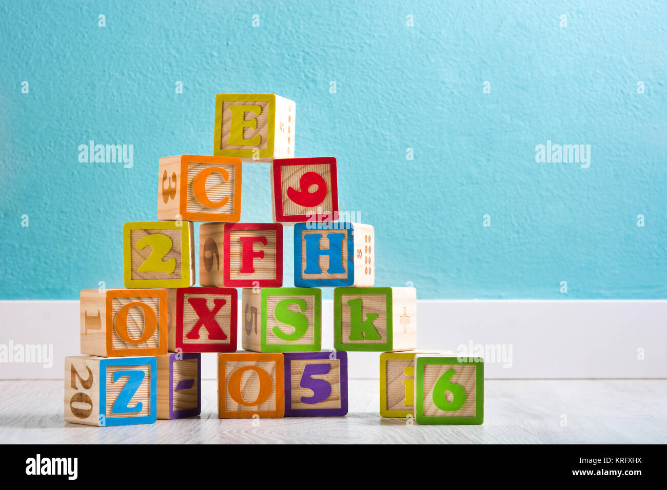 Wooden cubes with letters and numbers in a baby's room Stock Photo - Alamy