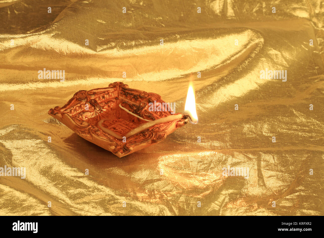 Golden Diwali - Handmade Diya in gold color background Stock Photo - Alamy