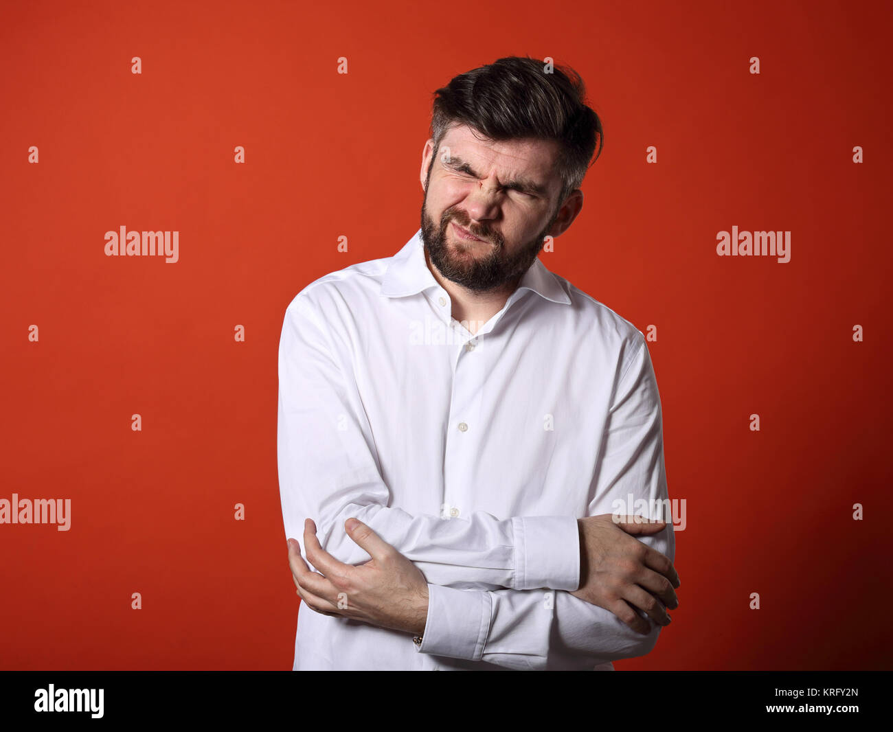 Disgusted grimacing bearded business man with closed eyes and unhappy ...