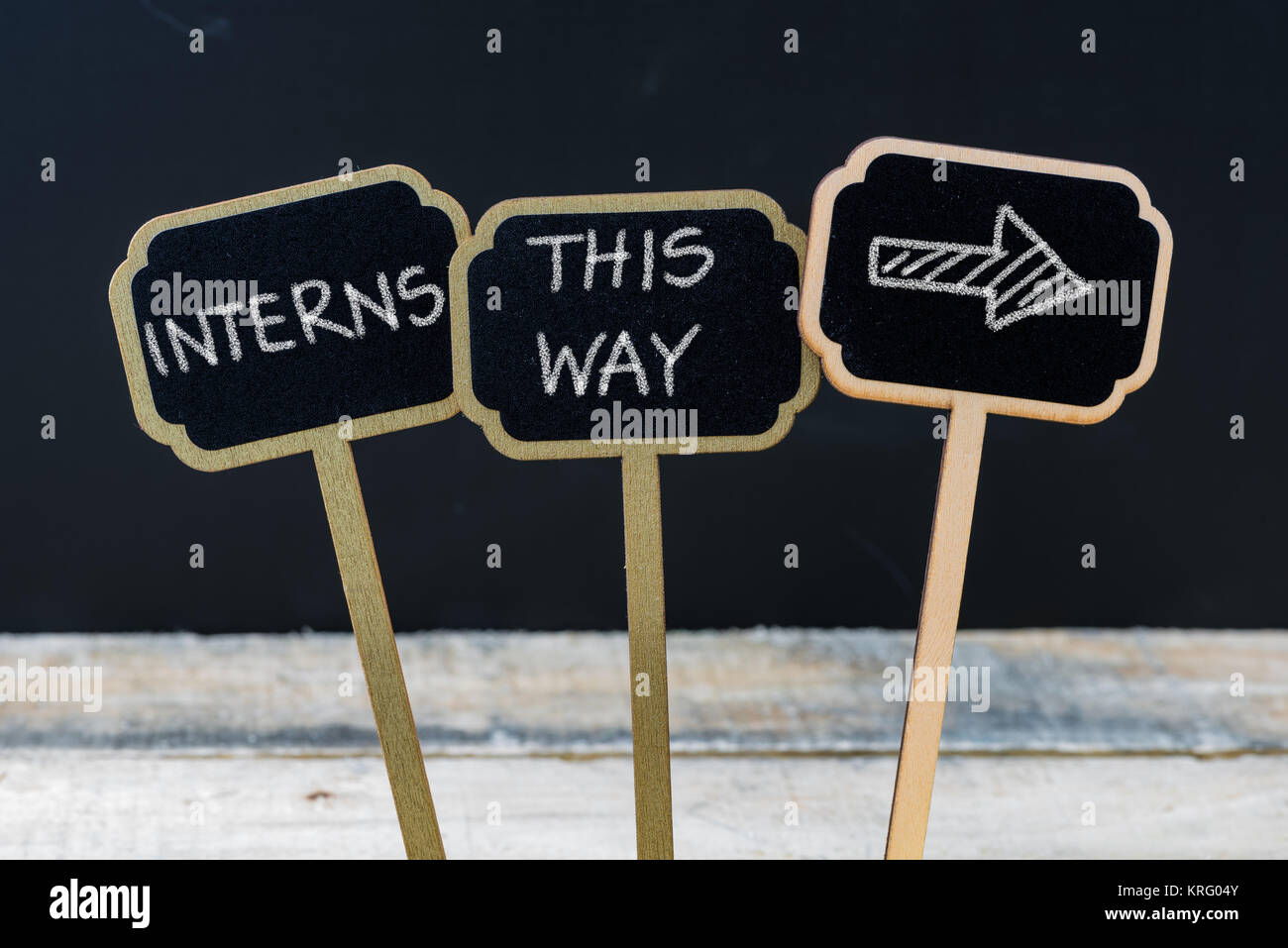 Business message INTERNS THIS WAY Stock Photo - Alamy