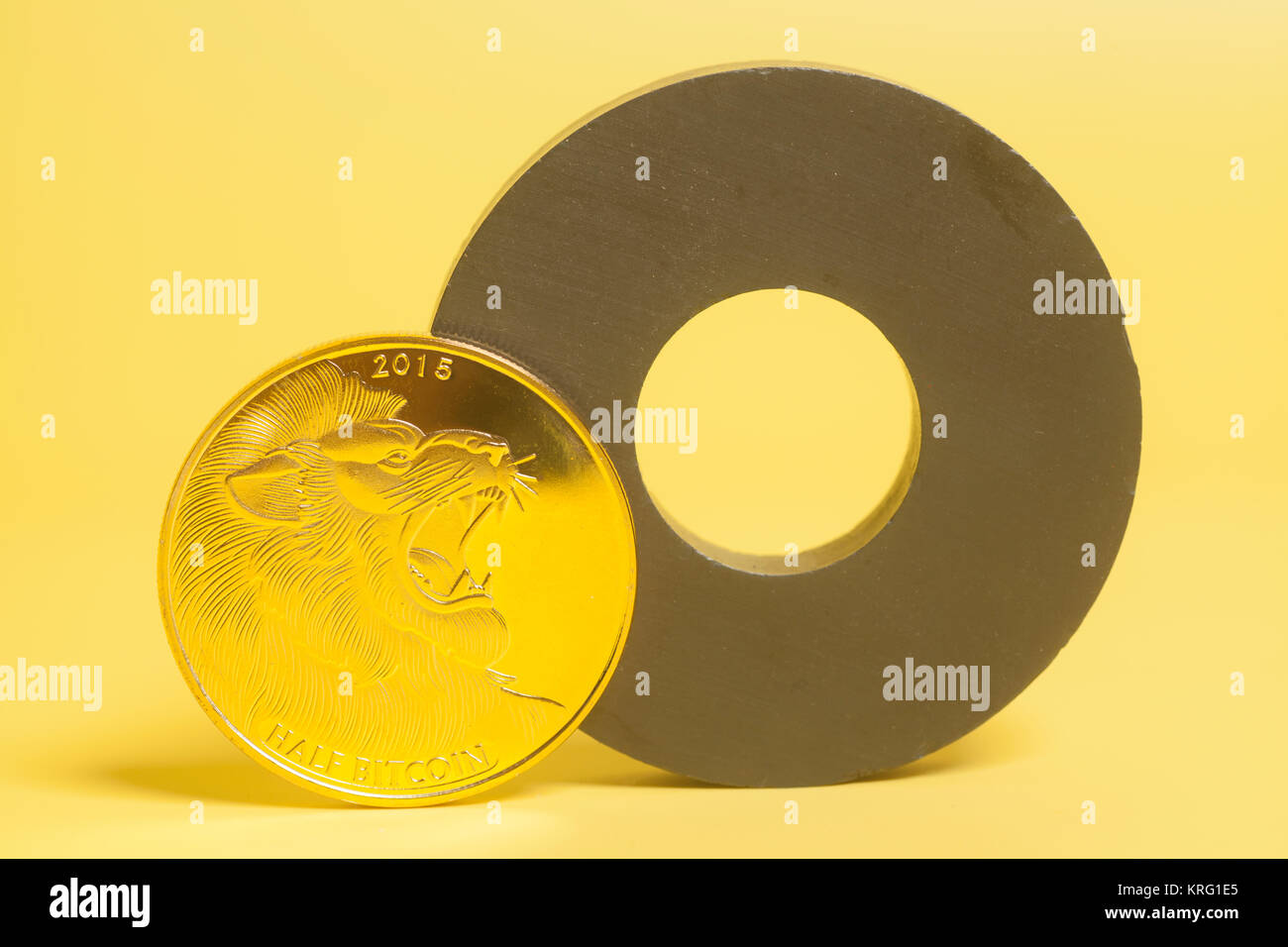 Half bitcoin with lion end magnet Stock Photo - Alamy