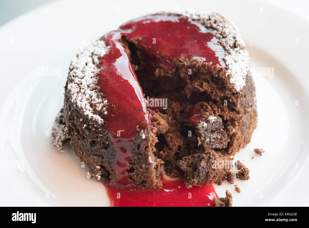 Chocolate cake with raspberry sauce Stock Photo - Alamy