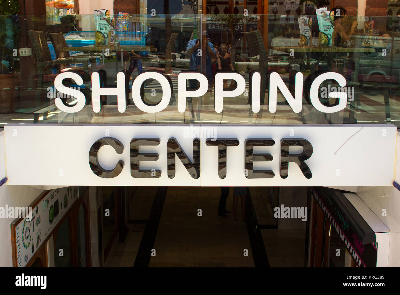A large sign saying Shopping Center above the stairwell to the small ...