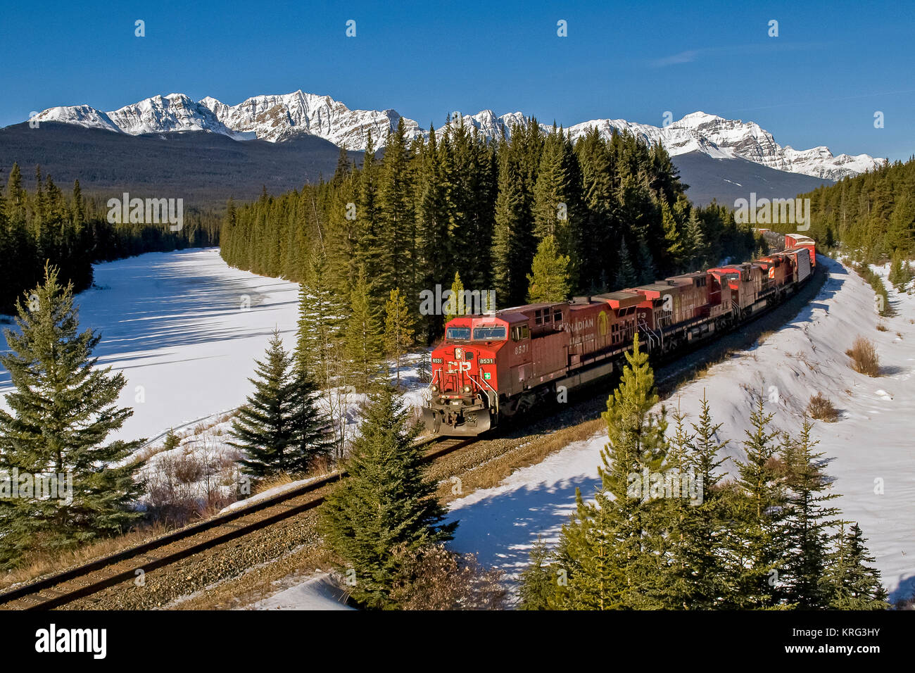CP Rail intermodal freight eastbound pulled by 4 locos led by 8531 passes Storm Mountain lookout ...