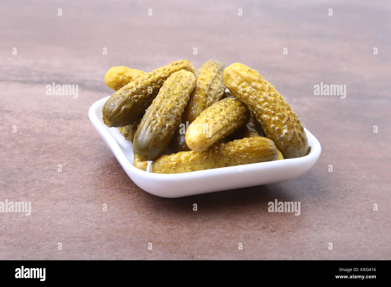 Pickles. Bowl of pickled gherkins cucumber with copy space. Cornichons ...
