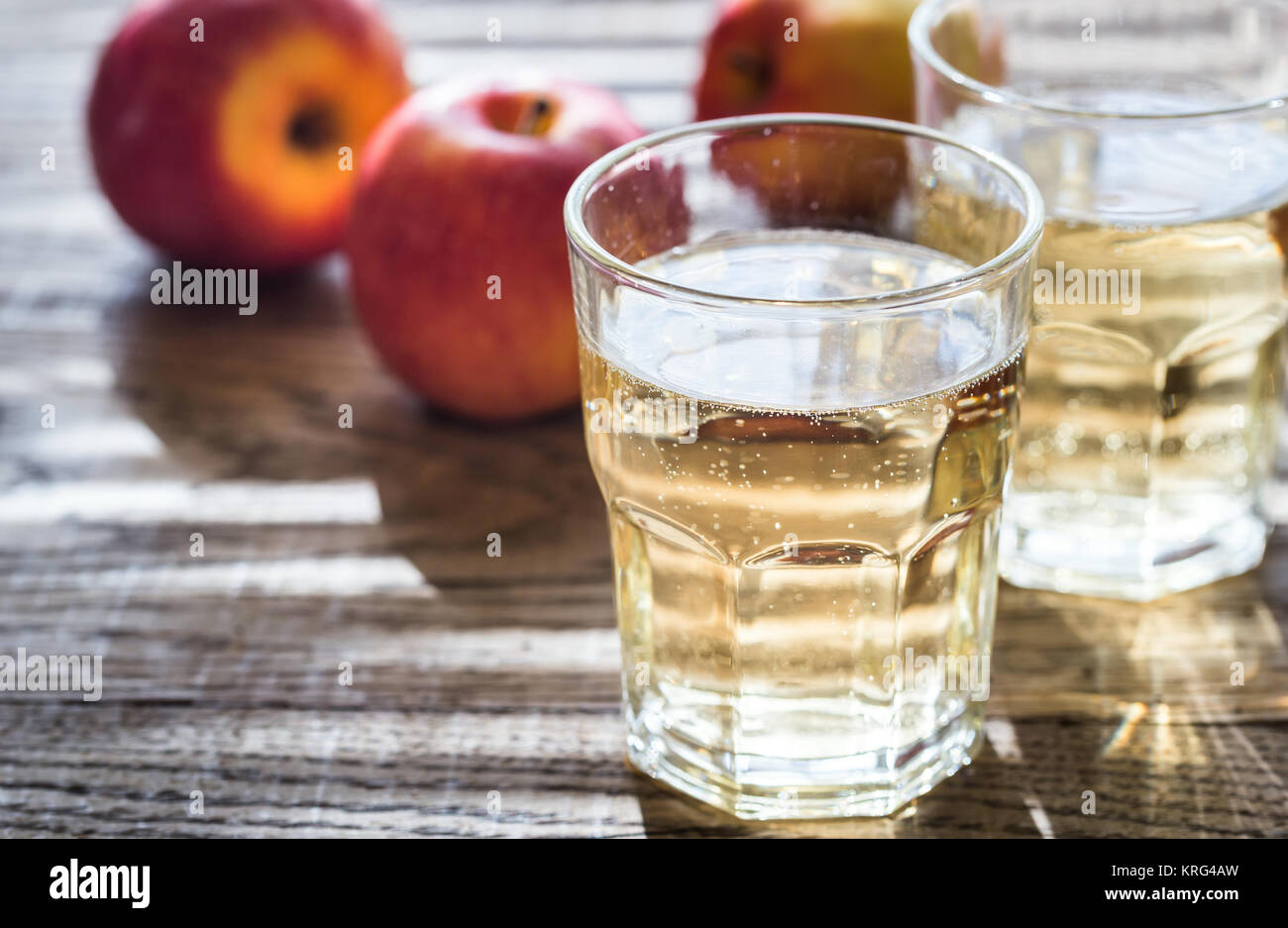 Bottle and two glasses of cider Stock Photo - Alamy