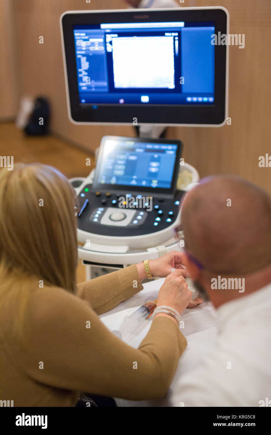 Medical doctor student learning to use ultra sound scanner machine ...