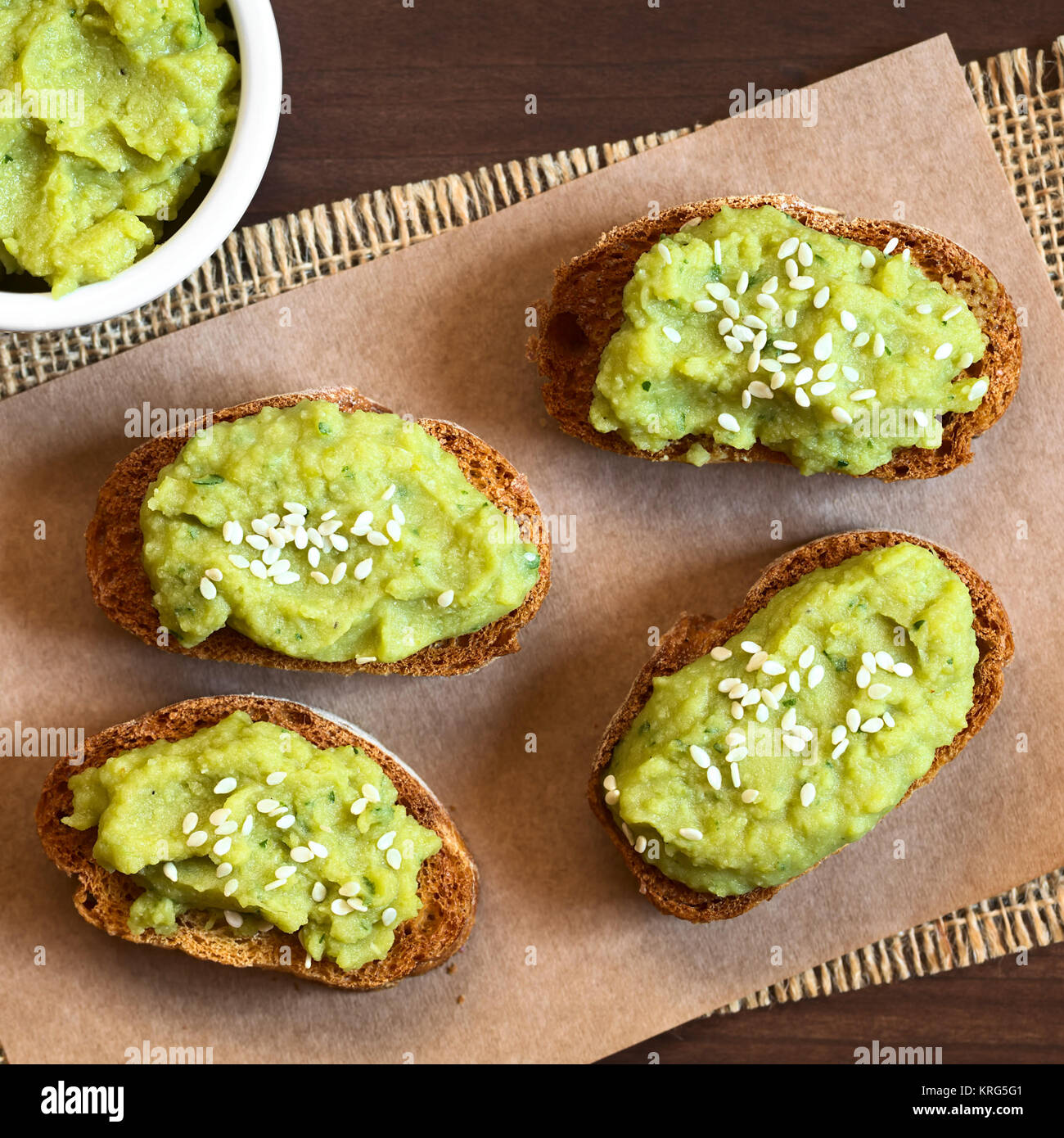 Bread with Green Pea Spread and Sesame Seeds Stock Photo - Alamy