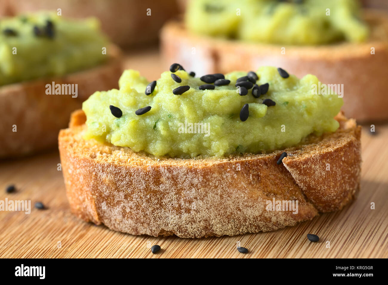 Bread with Green Pea Spread and Sesame Seeds Stock Photo - Alamy