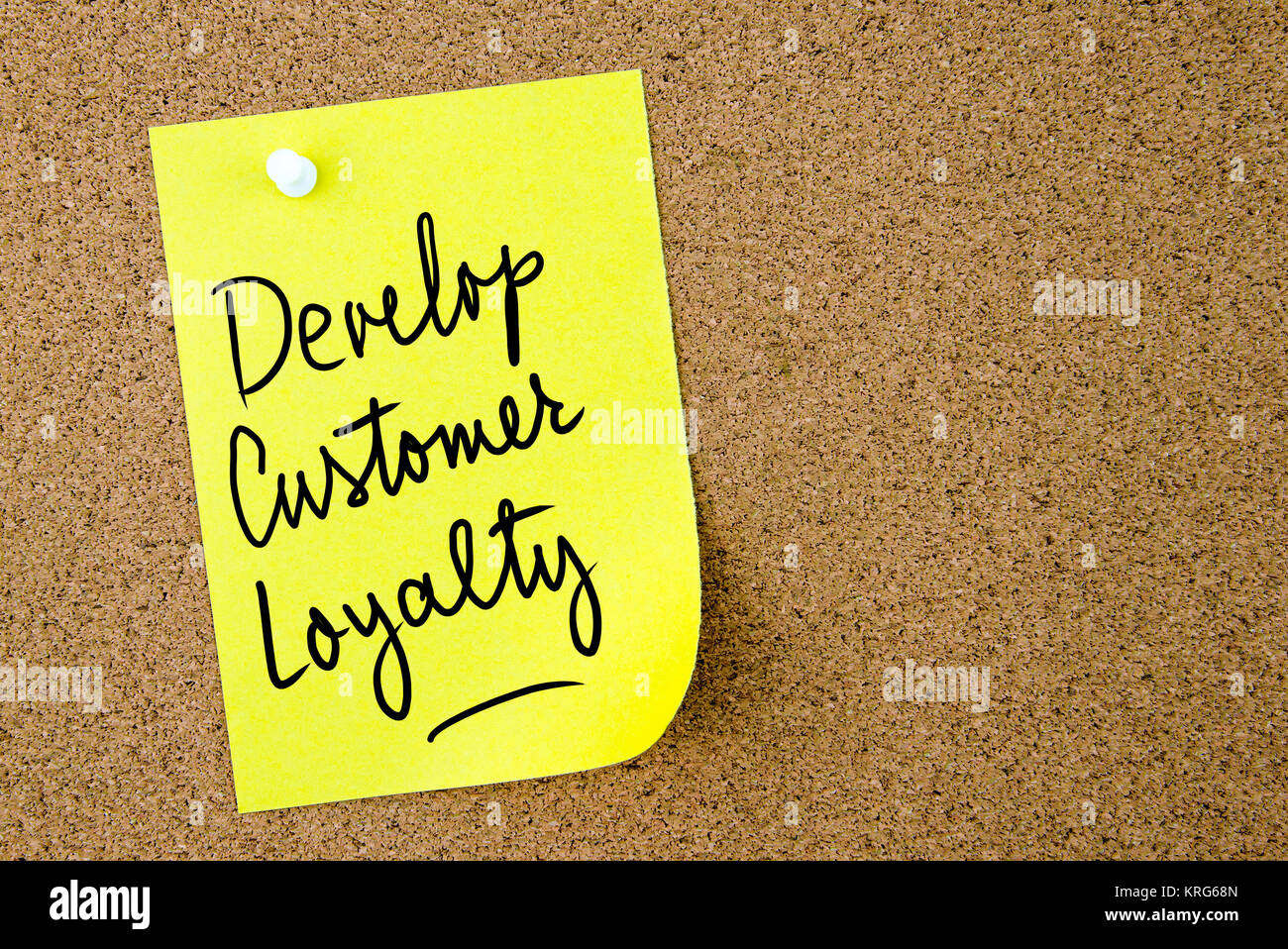 Develop Customer Loyalty text written on yellow paper note Stock Photo ...