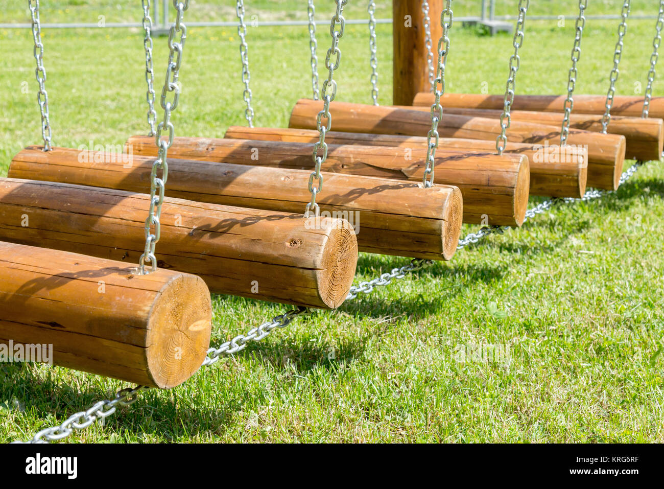 childrens bridge made of logs and chains Stock Photo - Alamy