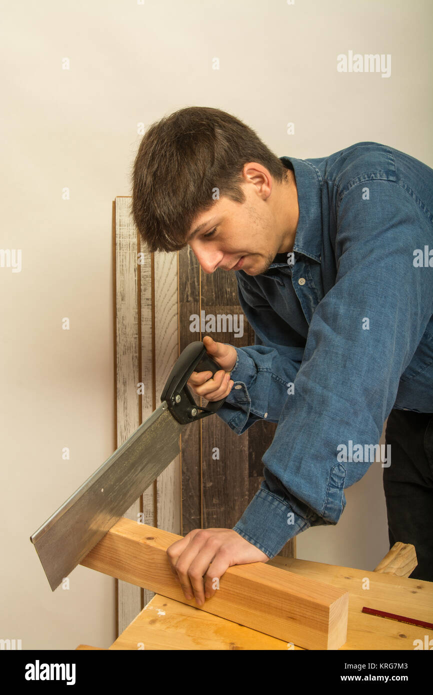 worker man working on wood taking measures Stock Photo - Alamy