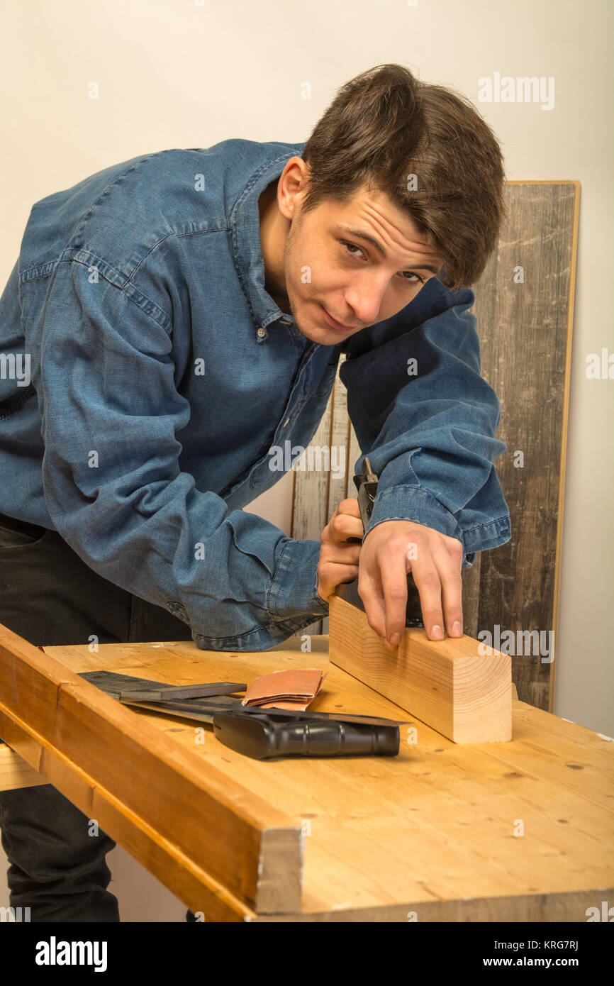 worker man working on wood taking measures Stock Photo - Alamy