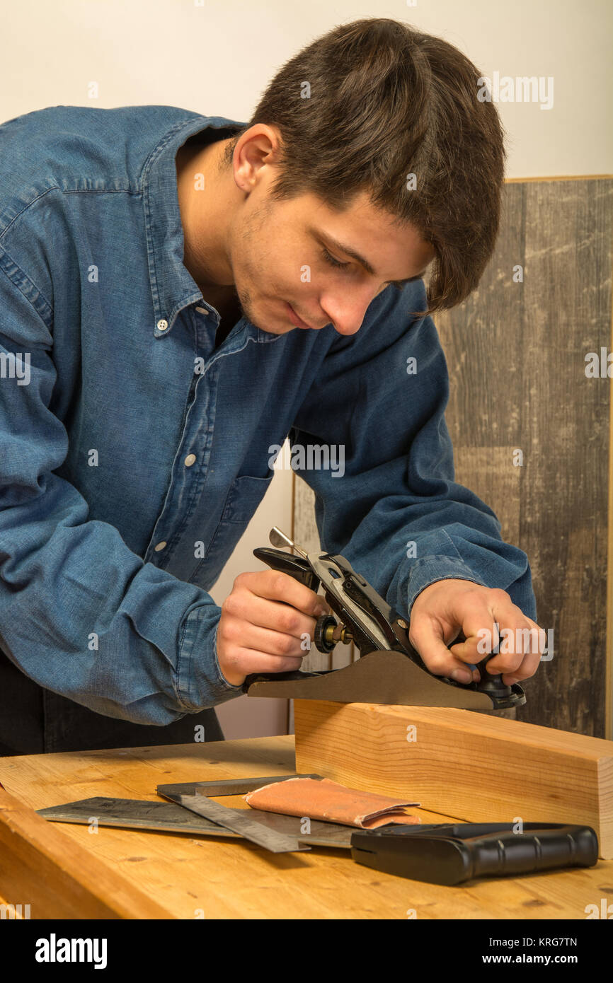worker man working on wood taking measures Stock Photo - Alamy