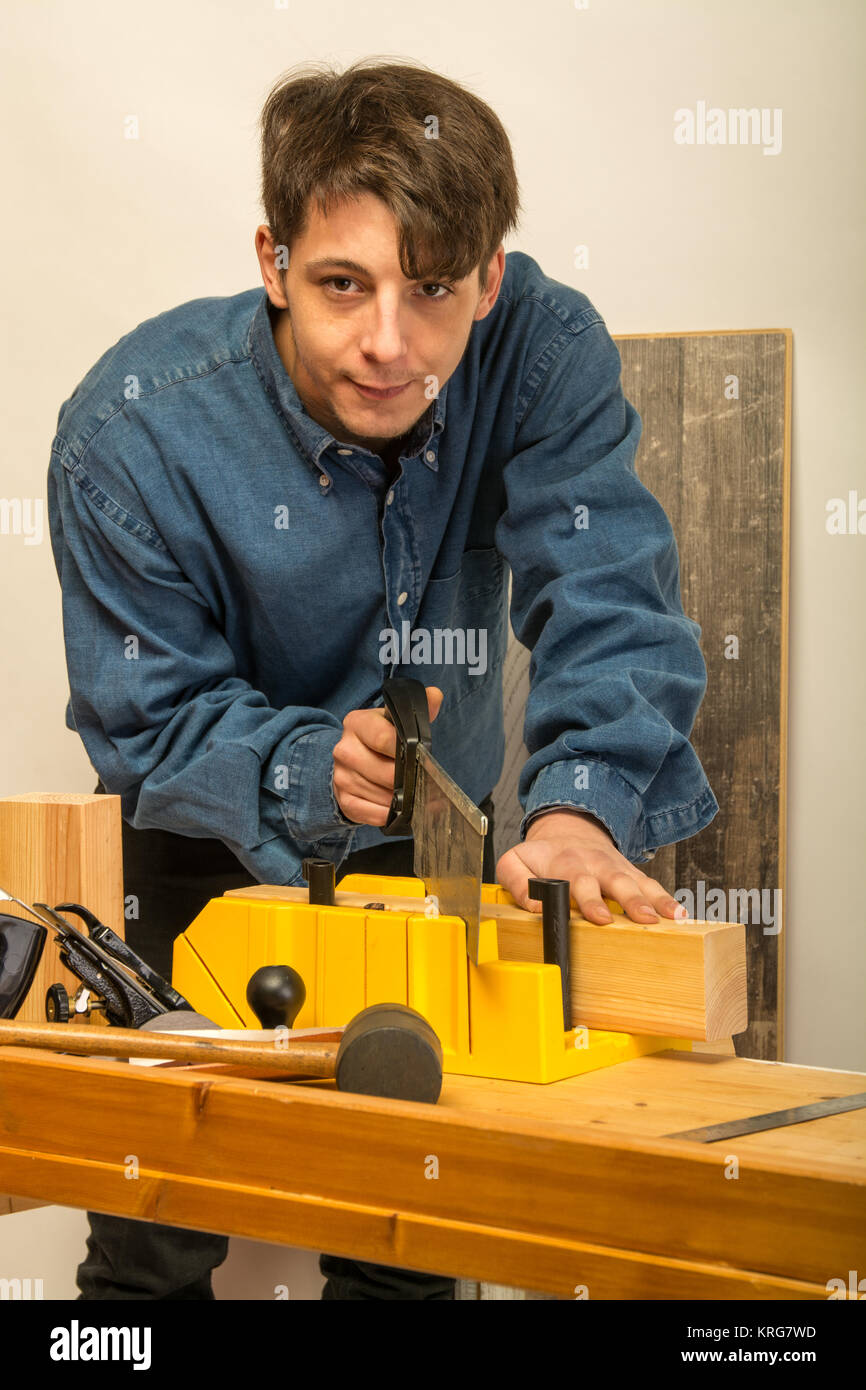 worker man working on wood taking measures Stock Photo - Alamy