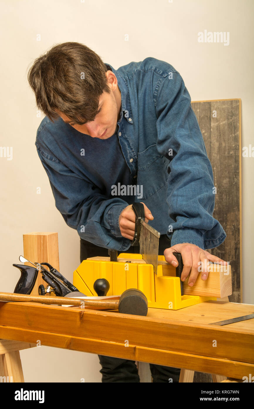 worker man working on wood taking measures Stock Photo - Alamy