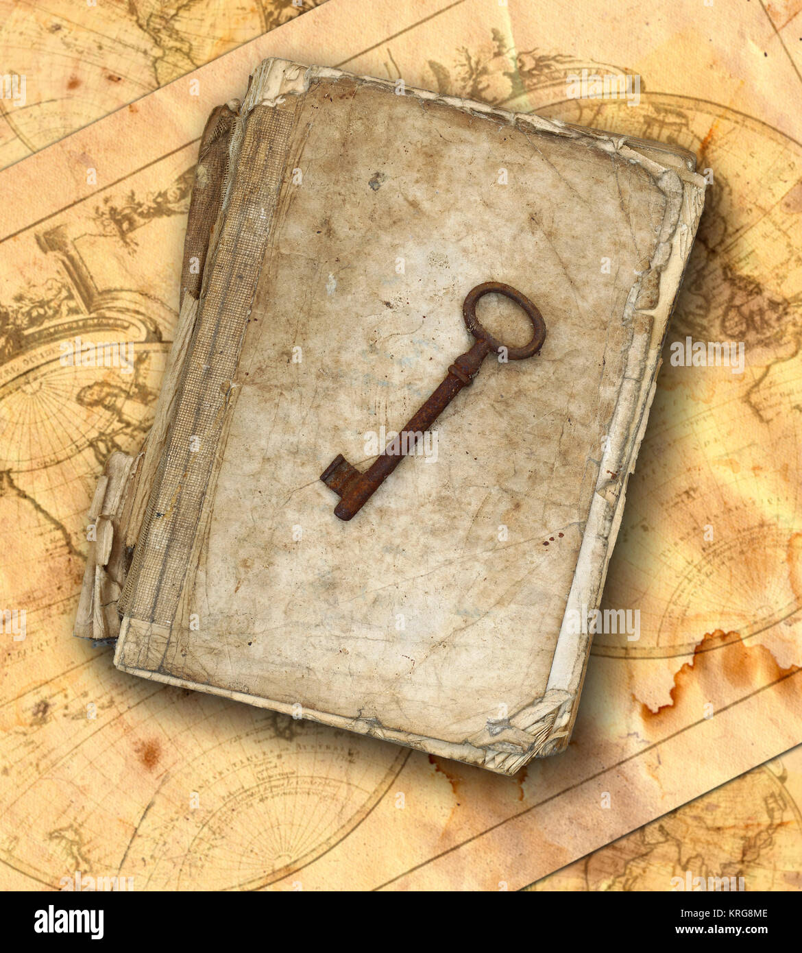 Worn and tattered book and old rusty key on the old maps Stock Photo ...