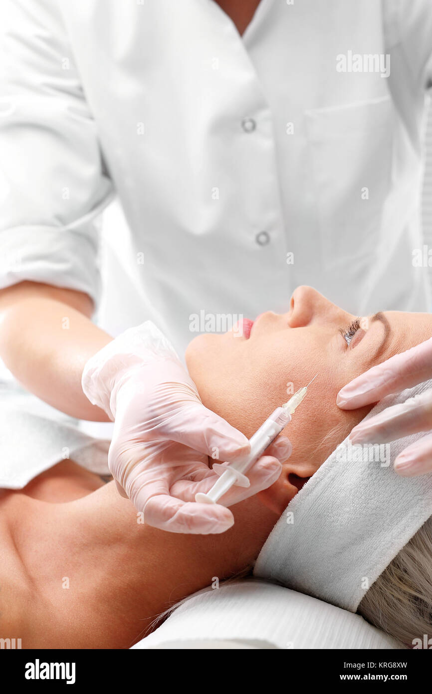 Dermatologist injecting botox injection hi-res stock photography and ...