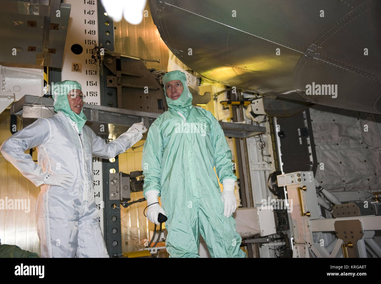 STS-135 Sandy Magnus and Chris Ferguson check the payload bay Stock Photo - Alamy
