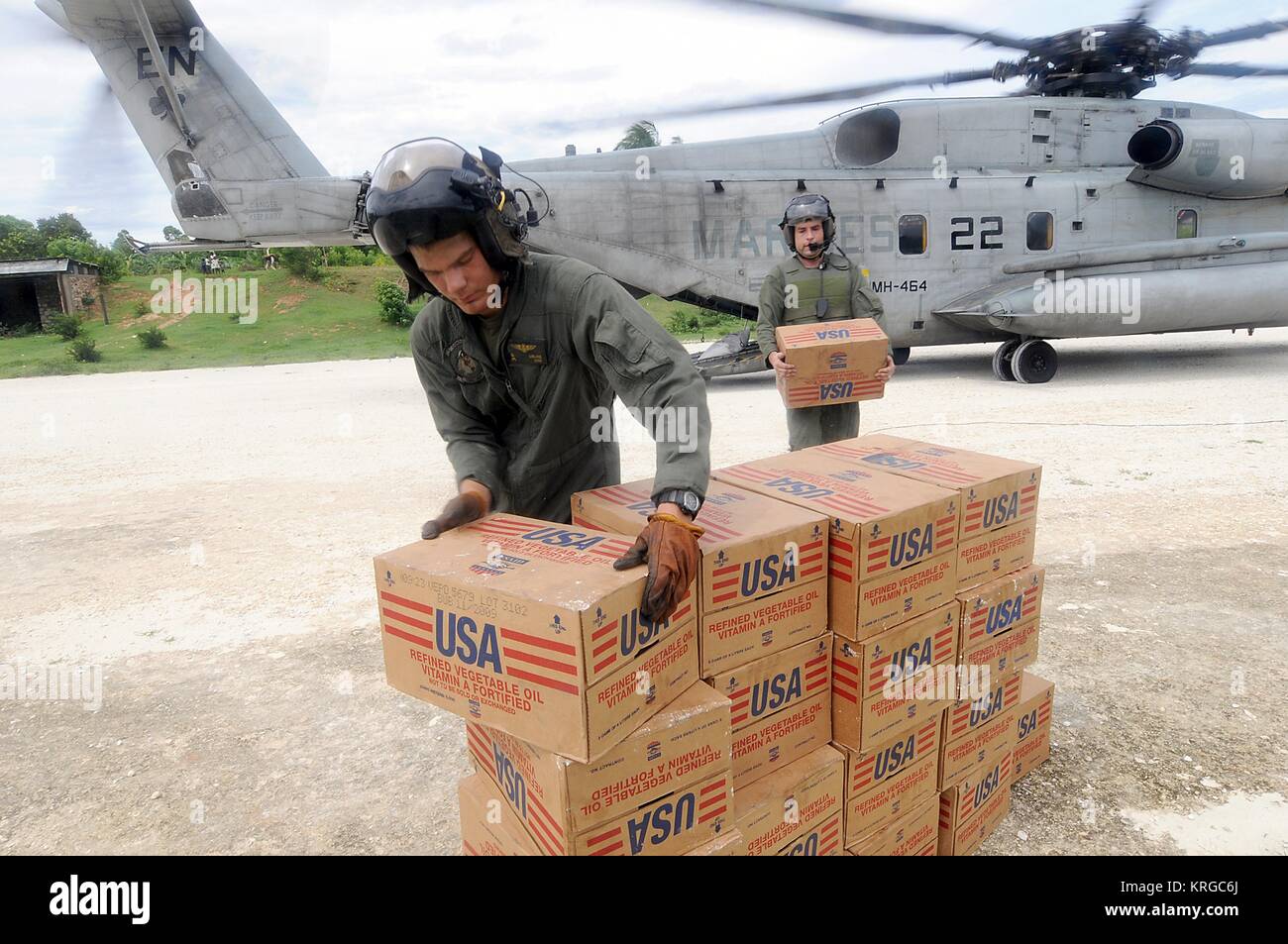 U.S. Marine soldiers unload disaster relief supplies during a ...