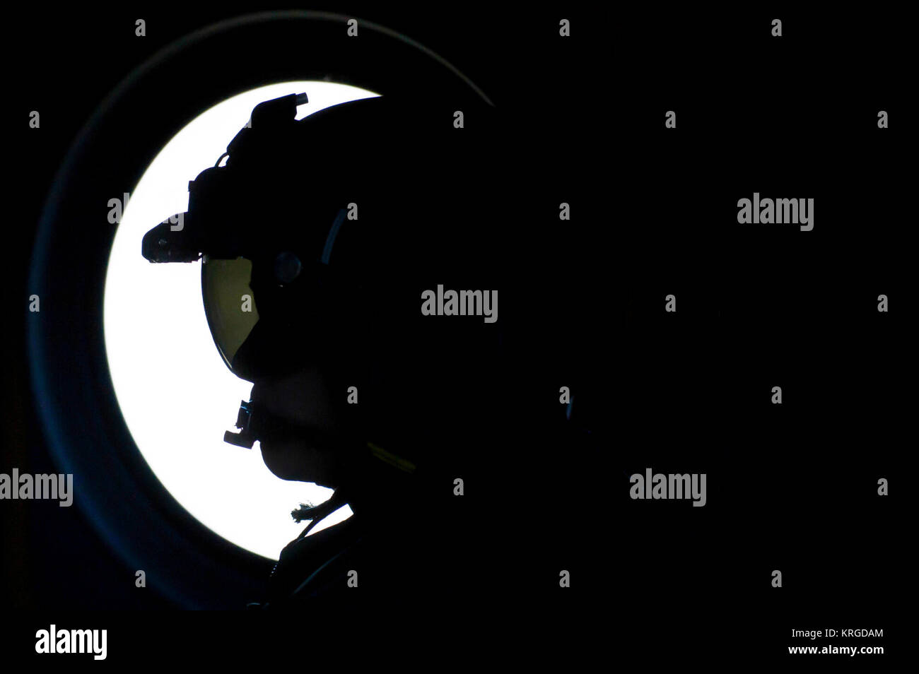 A Singapore air force crew chief sits by a CH-47 Chinook window during ...