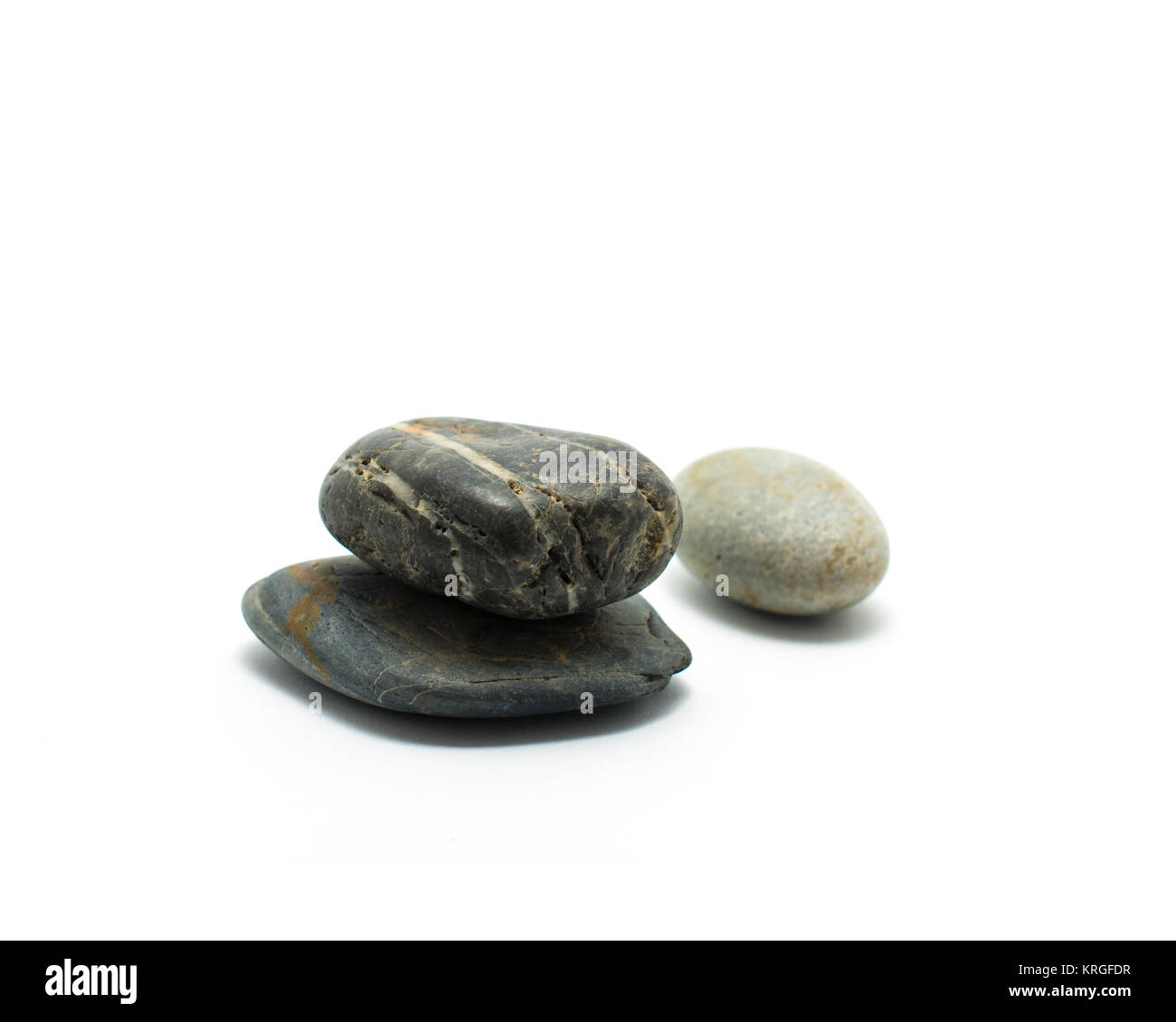 Three stones are stacked isolated on white background. Zen stone Stock ...