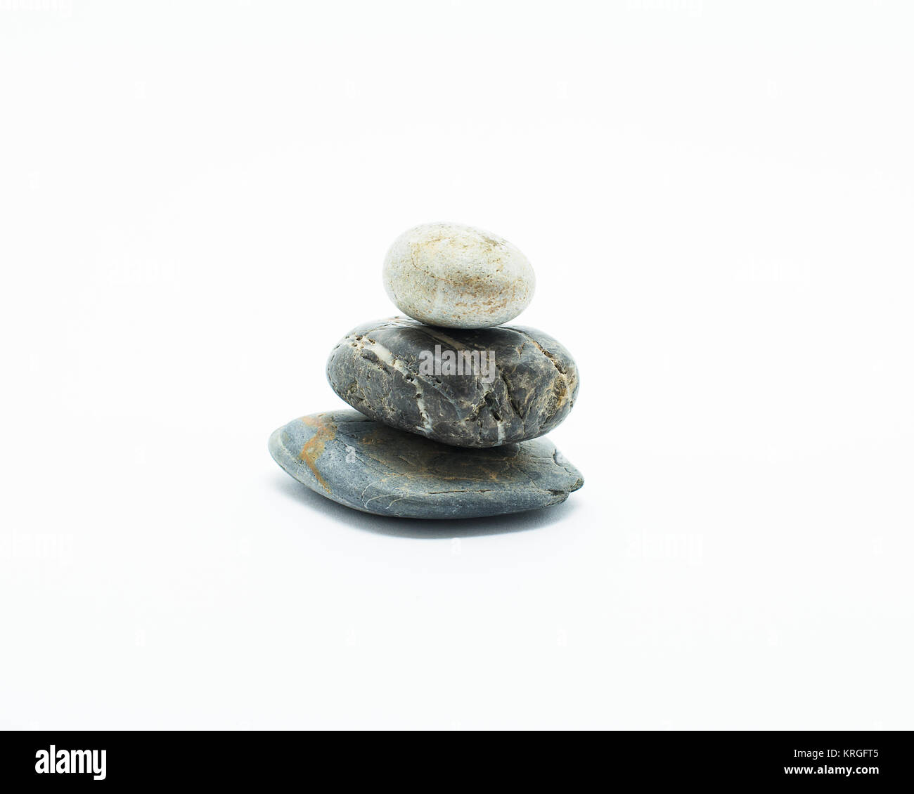 Three stones are stacked isolated on white background. Zen stone Stock ...