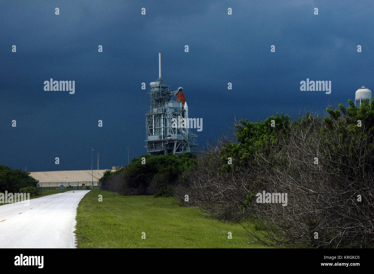 Dark clouds of a heavy rainstorm behind Space Shuttle Atlantis Stock ...