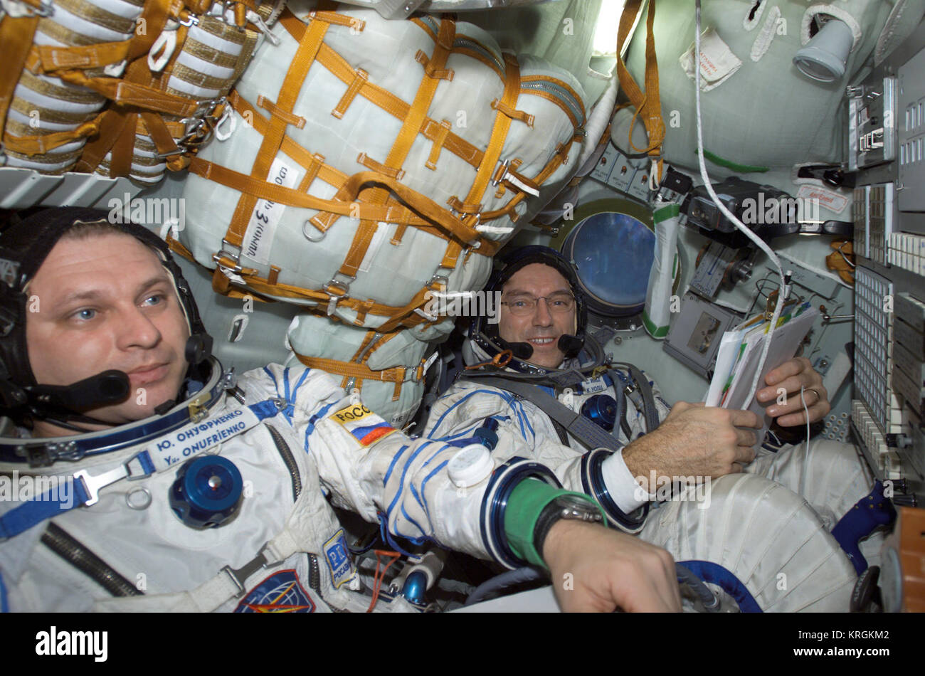 ISS-04 Yury Onufriyenko and Carl E. Walz in the Soyuz TM-33 spacecraft ...