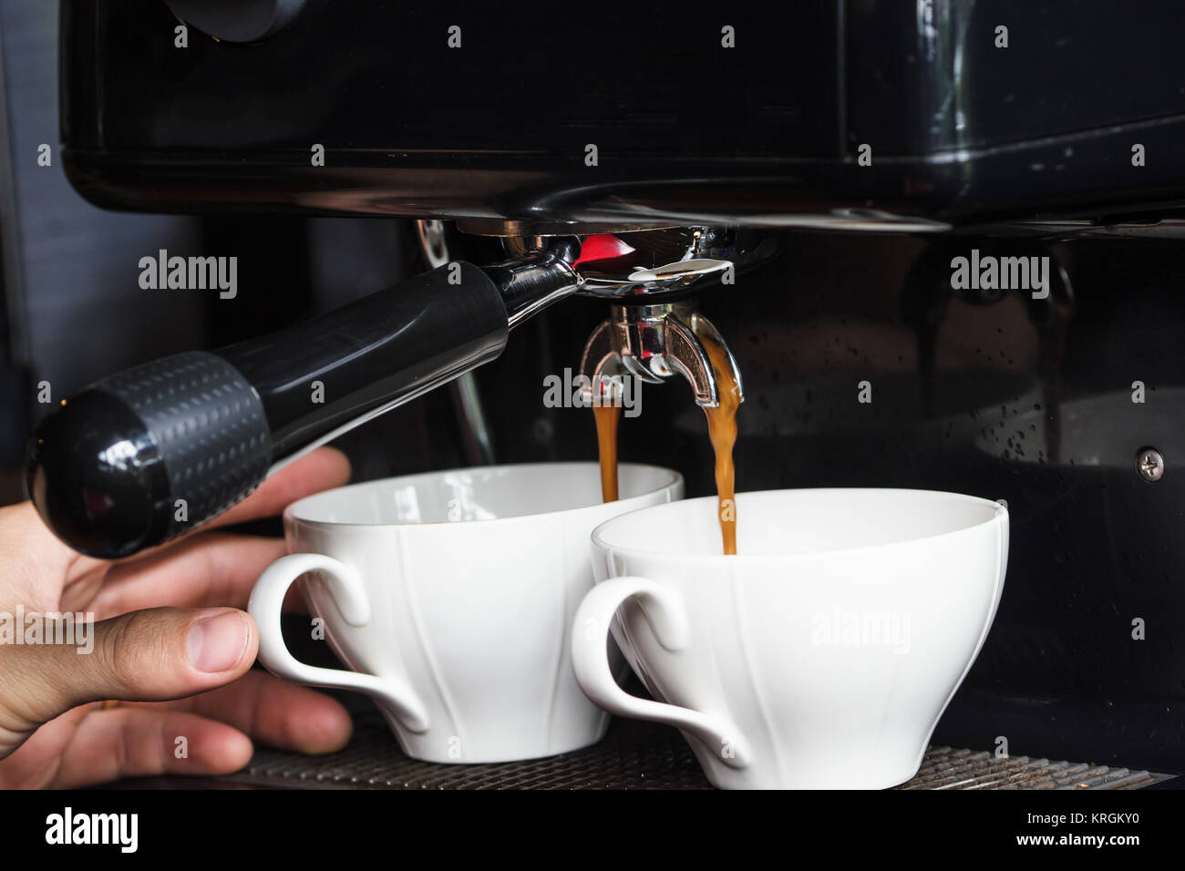 Coffee machine making two cup of fresh espresso background. Espresso is ...