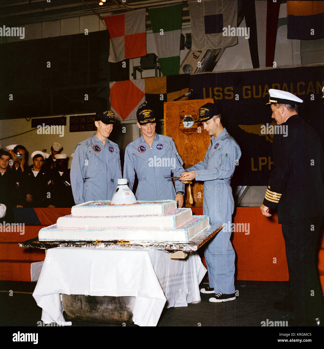 He Apollo 9 crew prepares to cut the 350-pound cake which was baked on ...