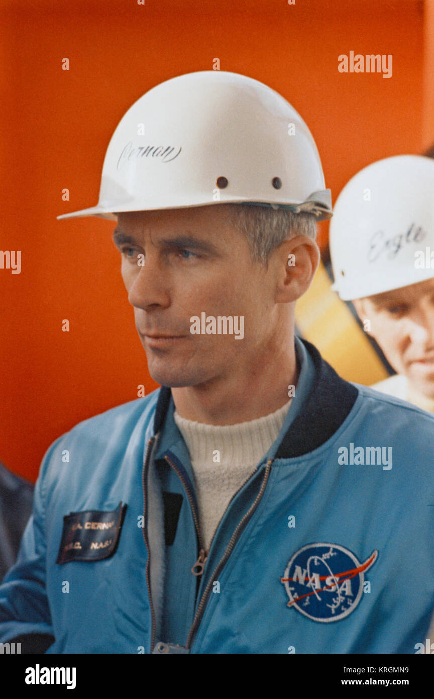 Astronaut Eugene A. Cernan, wearing a protective hat, participates in ...