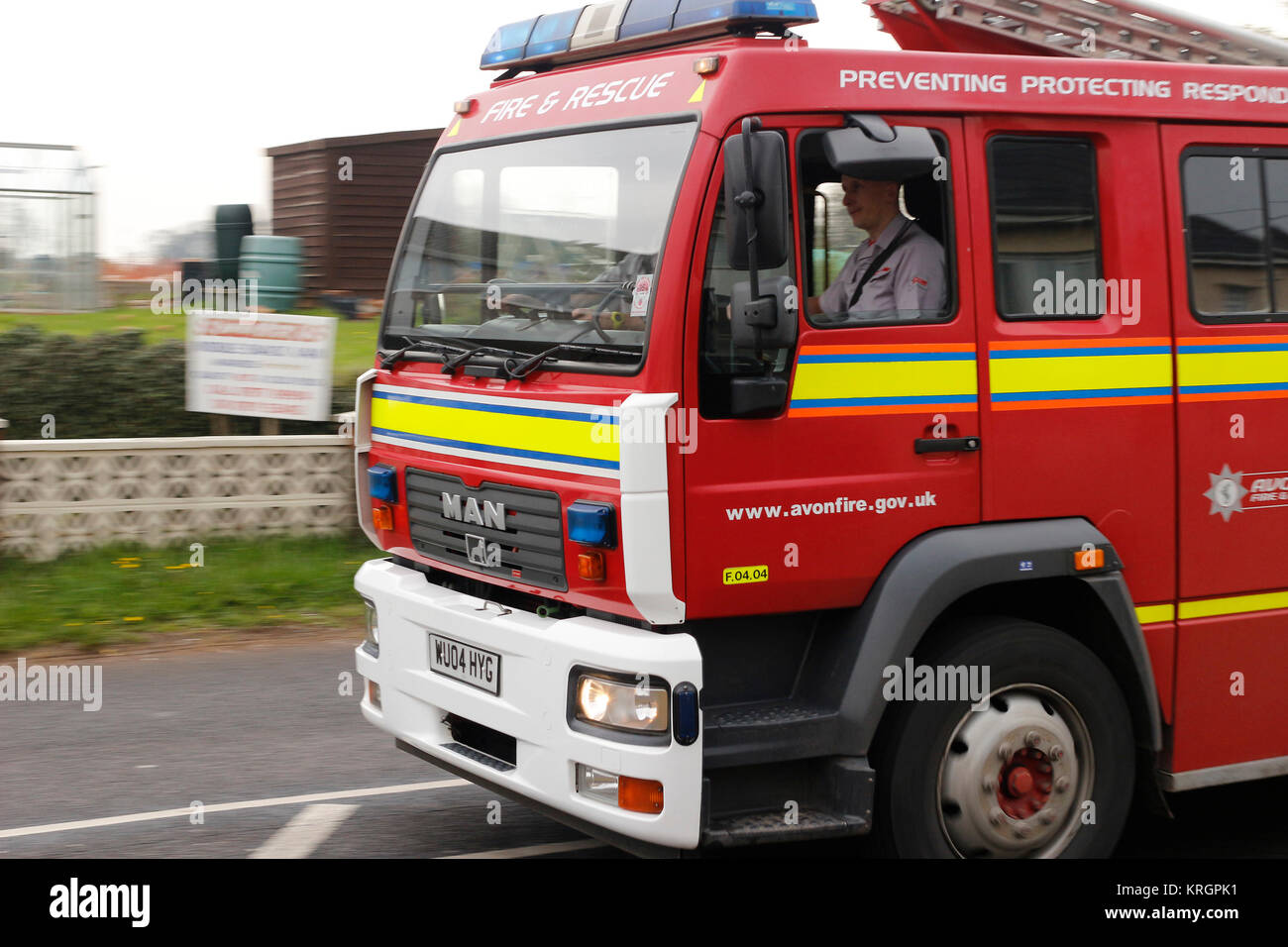 April 2014 - UK British fire engine at speed on a blue light emmergency ...