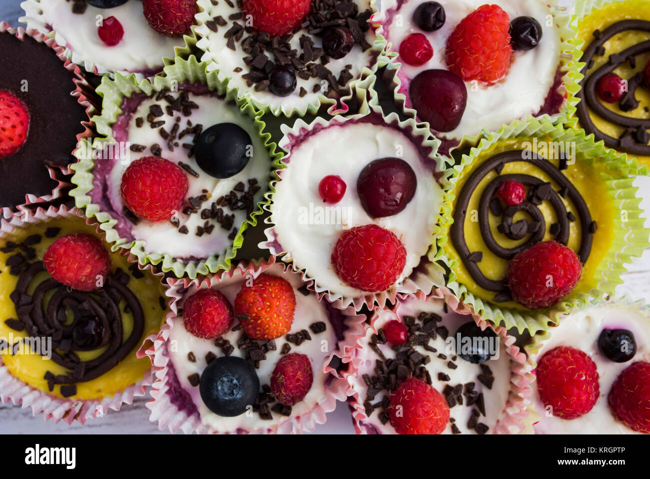 Colorful cupcakes with summer fruits in detail Stock Photo - Alamy