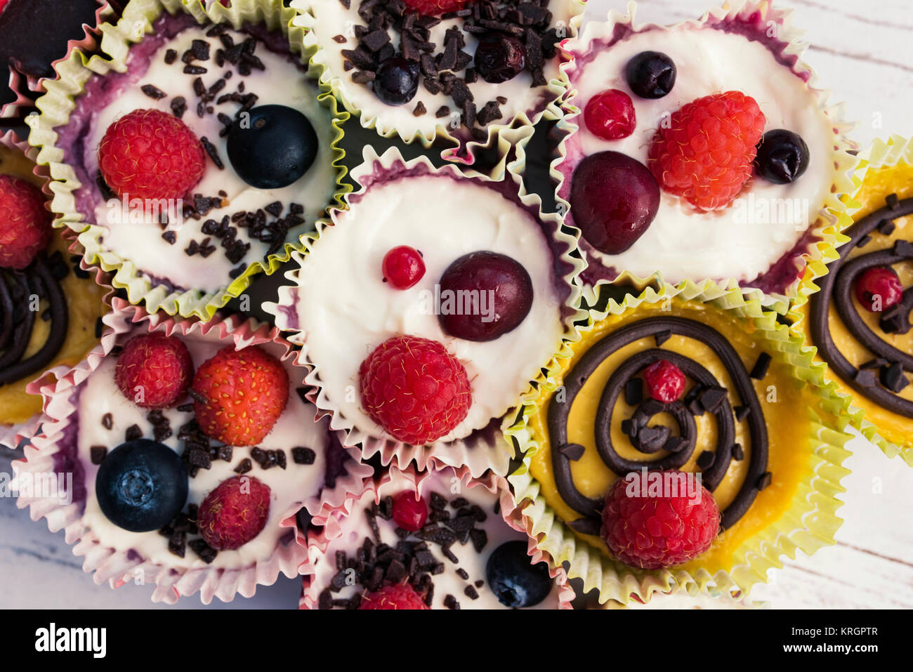 Colorful cupcakes with summer fruits in detail Stock Photo - Alamy
