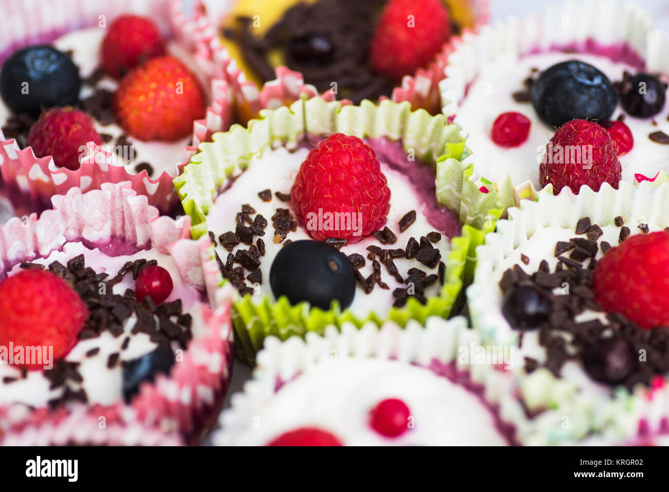 Colorful cupcakes with summer fruits in detail Stock Photo - Alamy