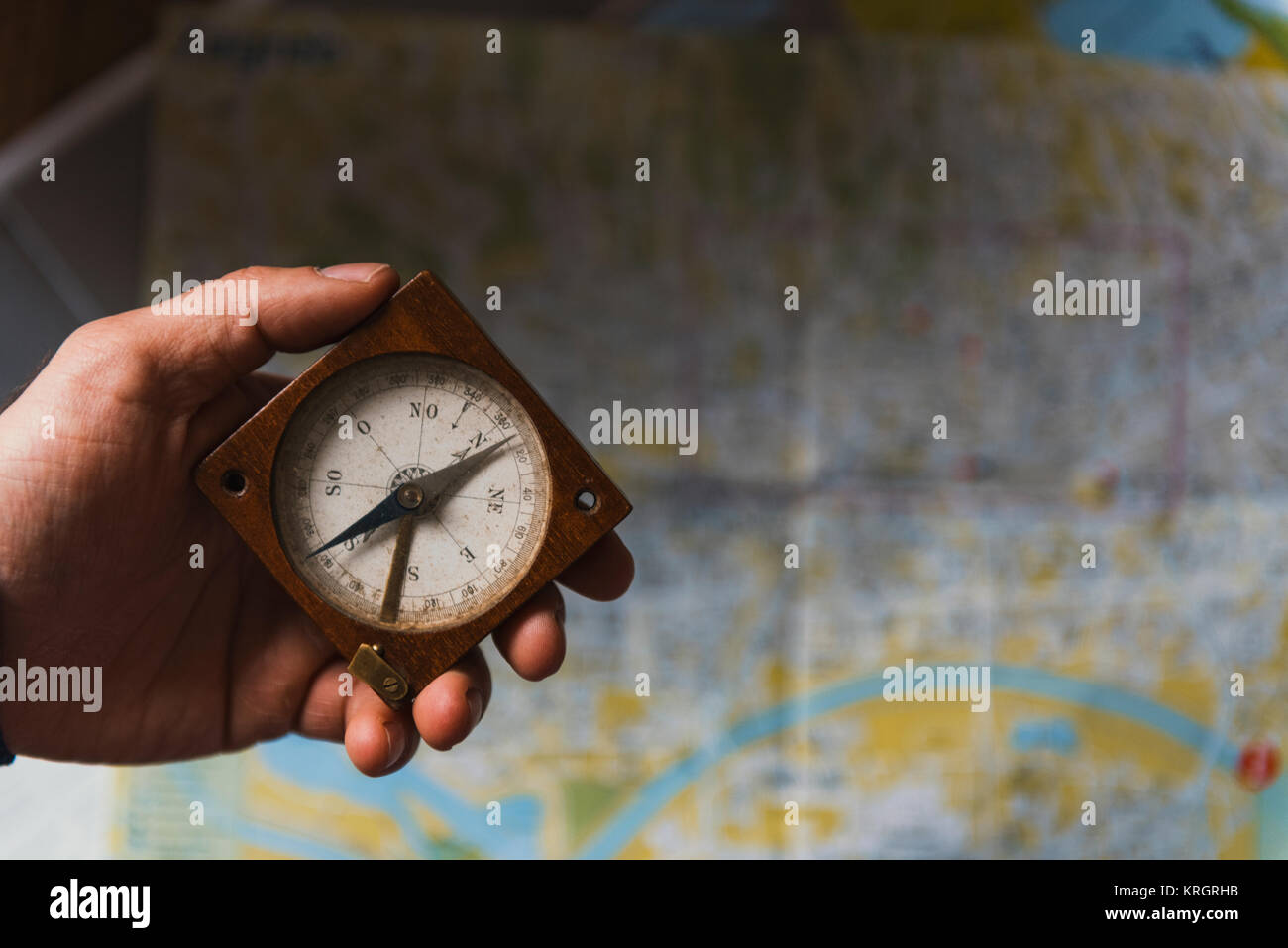 travel concept: girl with a compass Stock Photo - Alamy