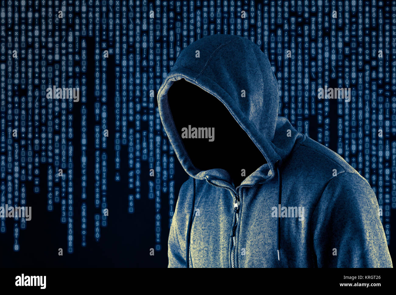 Hooded computer hacker with programming code Stock Photo - Alamy