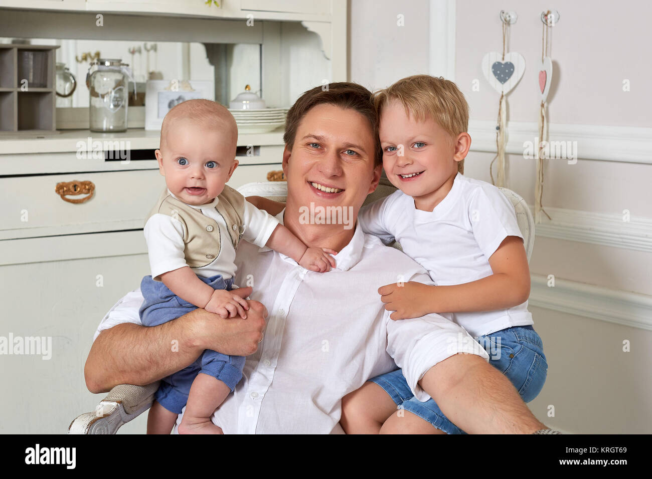 Happy father with two sons Stock Photo - Alamy